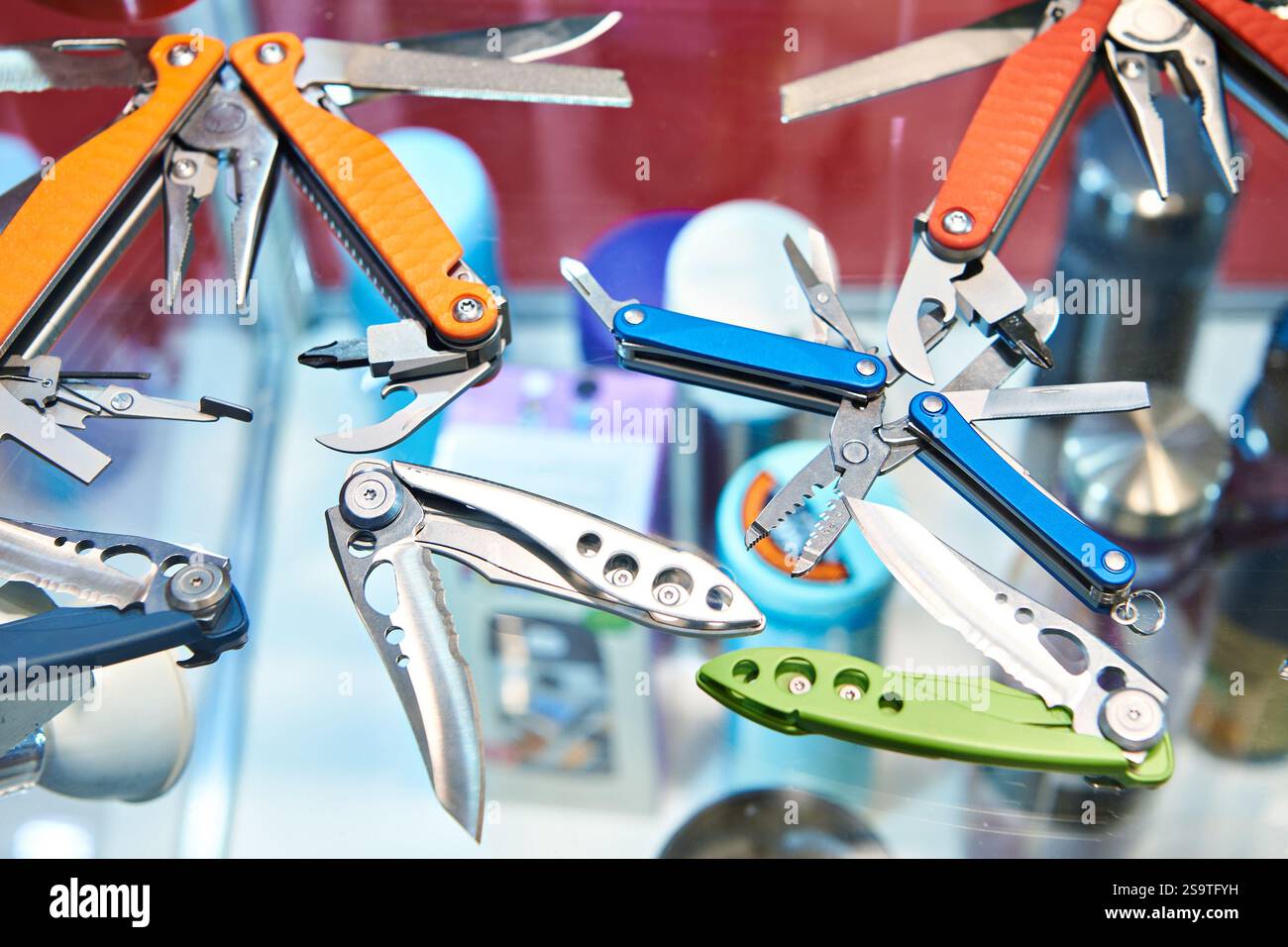 Folding knives multi-tool in store Stock Photo - Alamy