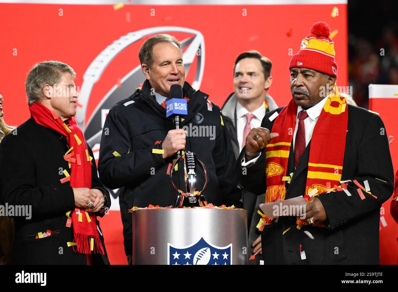 Jim Nantz, with mic, introduces Kansas City Chiefs Hall of Honor member ...