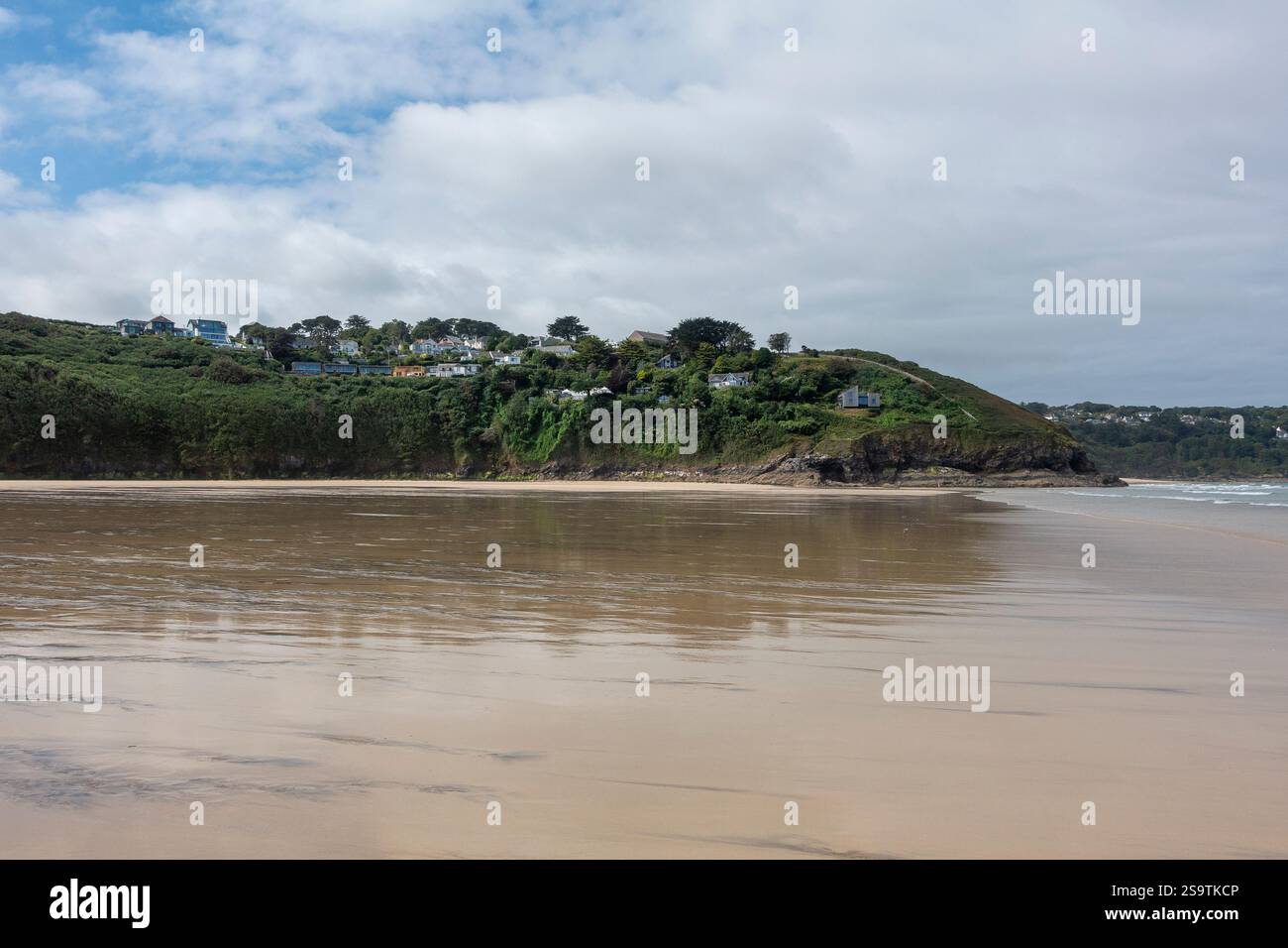 Walking across the beautiful and sandy Porthkidney beach towards Hawkes ...