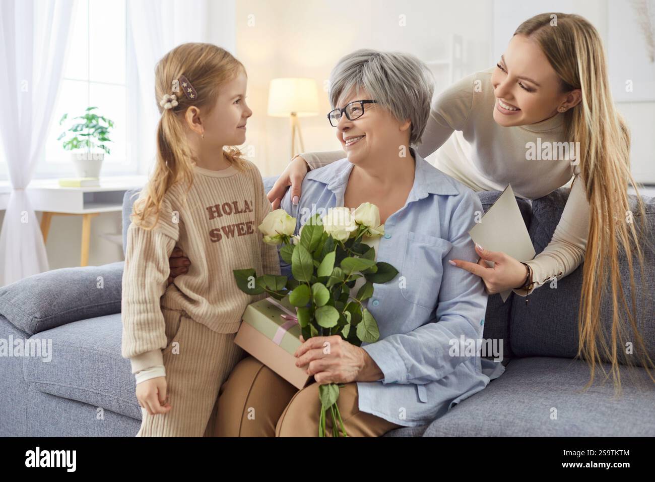 Old grandmother receives congratulations on birthday from daughter and ...