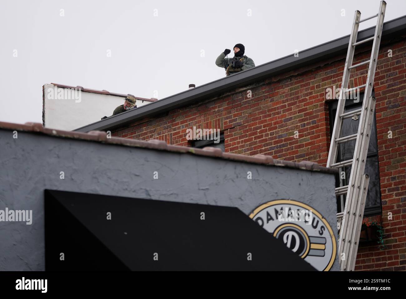 Security is seen on the roof near the Damascus Diner as Vice President ...
