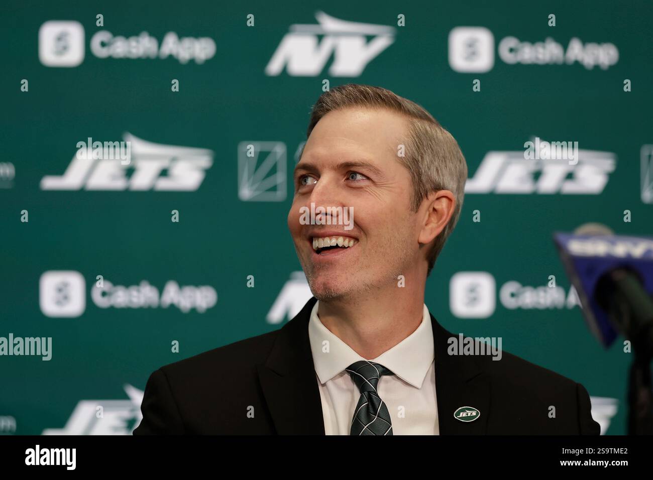 New York Jets new general manager Darren Mougey smiles during a press ...