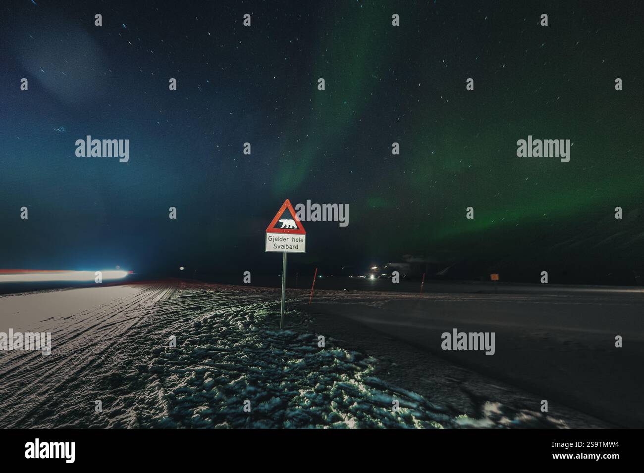 Northern lights over polar bear warning sign in Longyearbyen, Svalbard ...