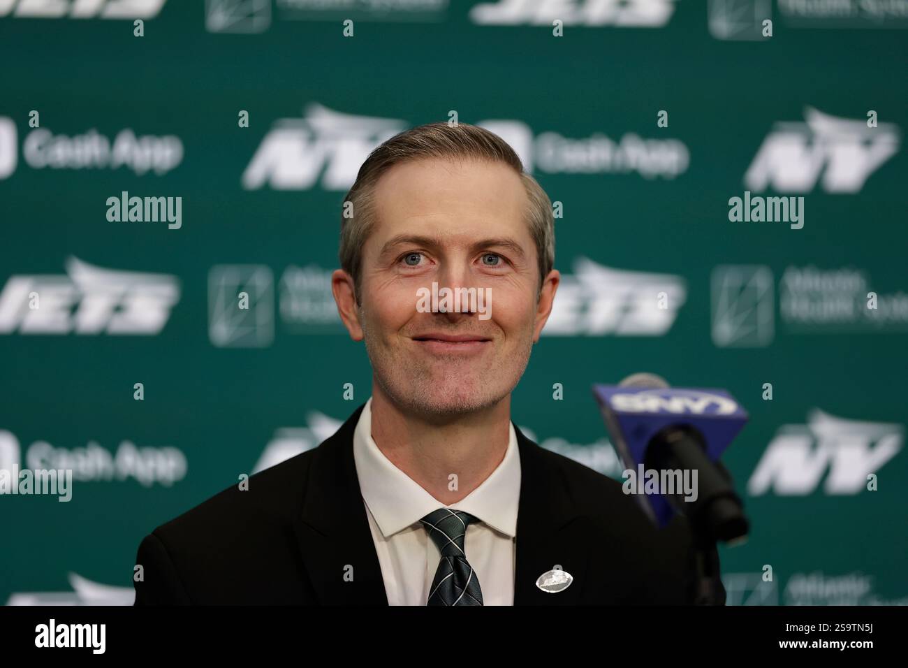 New York Jets new general manager Darren Mougey smiles during a press ...