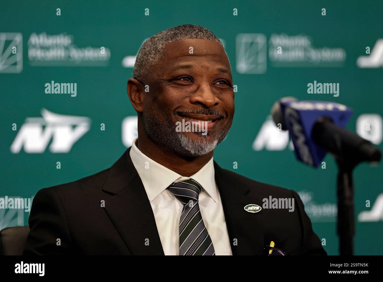 New York Jets new head coach Aaron Glenn smiles during a press ...