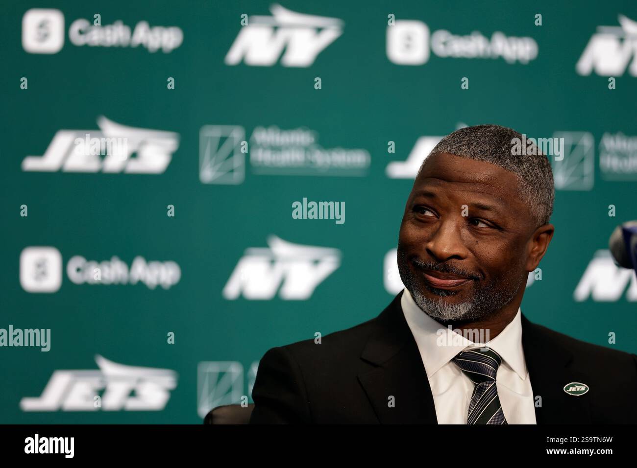 New York Jets new head coach Aaron Glenn smiles during a press conference at the NFL football ...