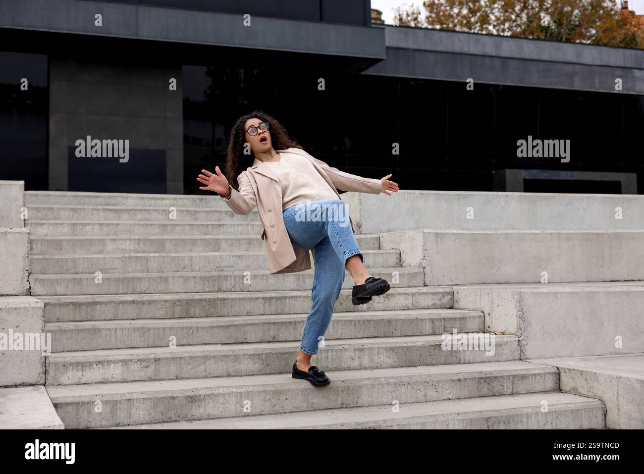 Woman falling on stairs outdoors. Dangerous accident Stock Photo - Alamy