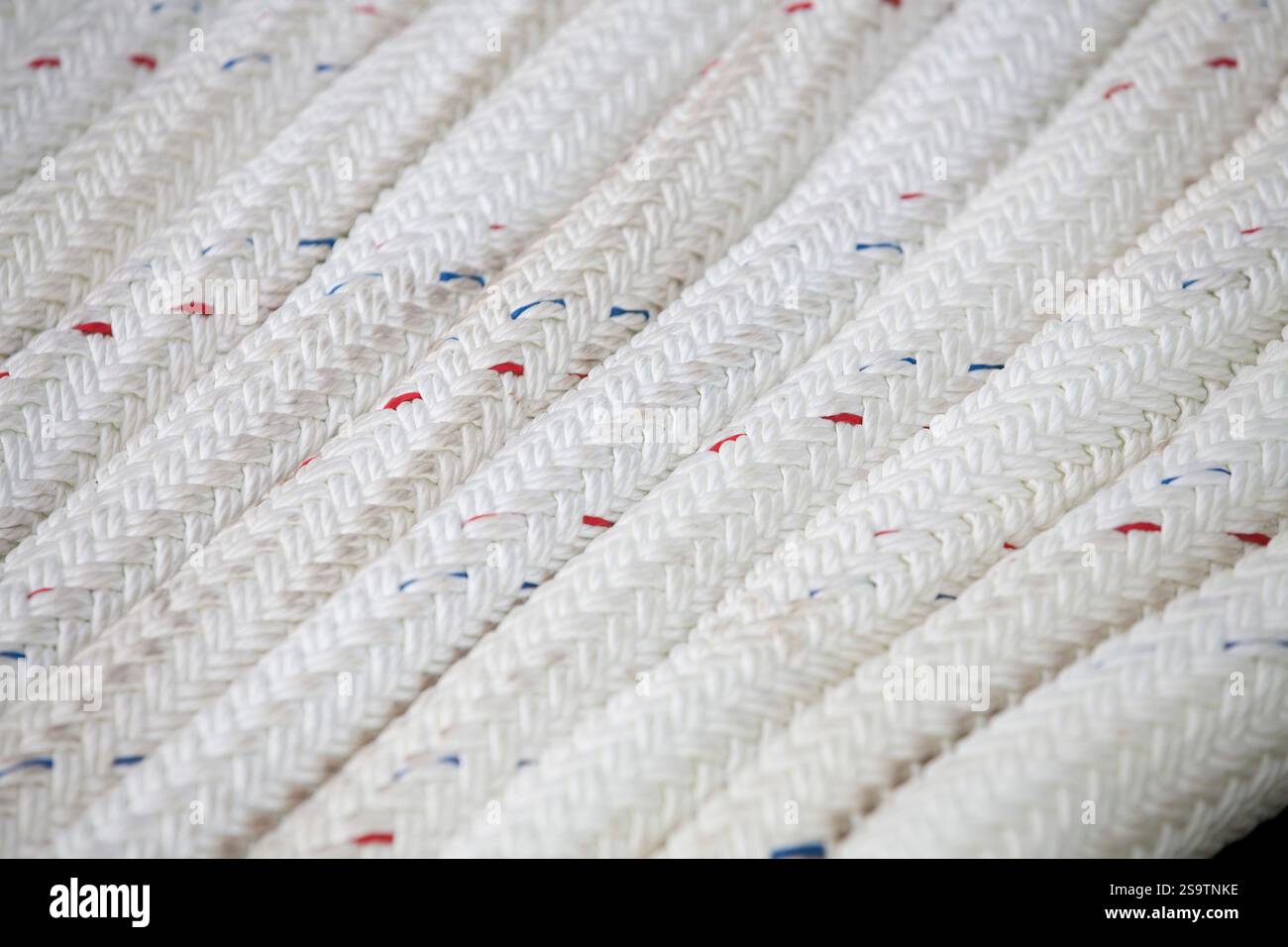 A large rope coiled on a dock Stock Photo - Alamy
