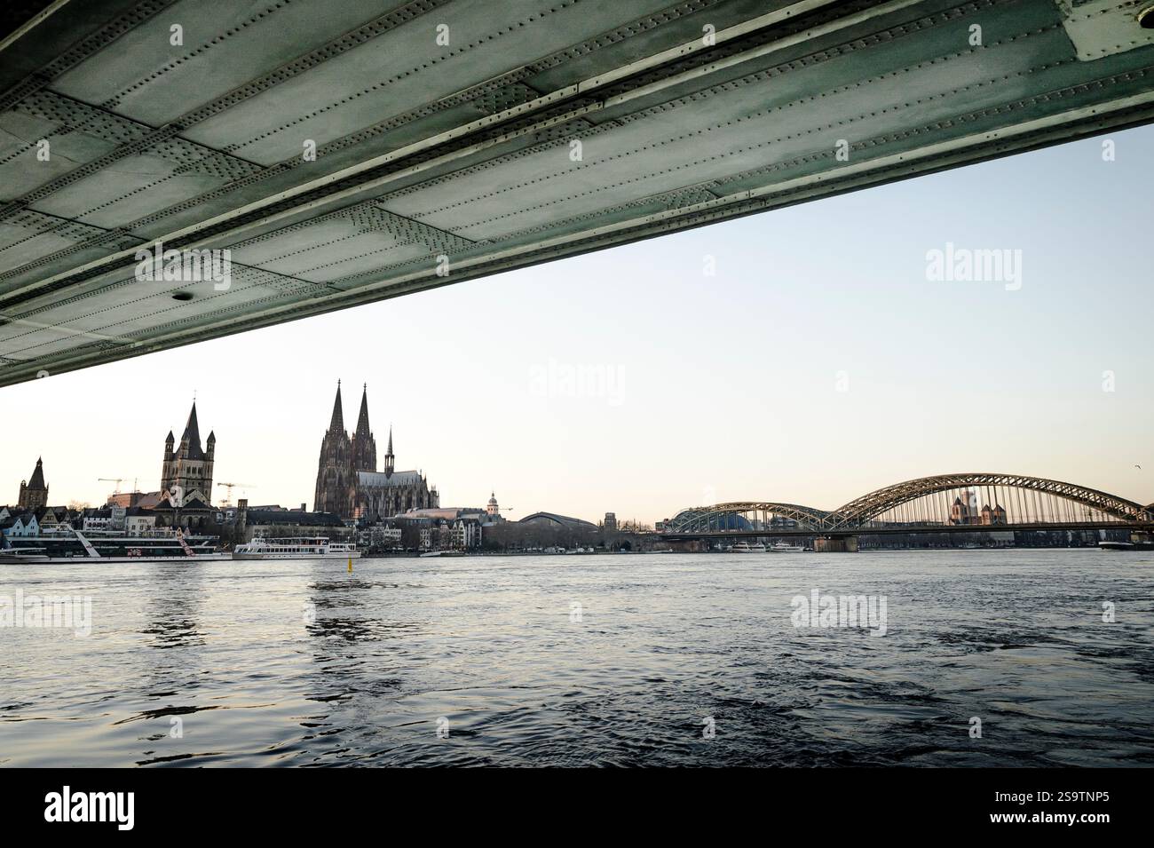 The fading light reflects off the Rhine River as Cologne's iconic ...