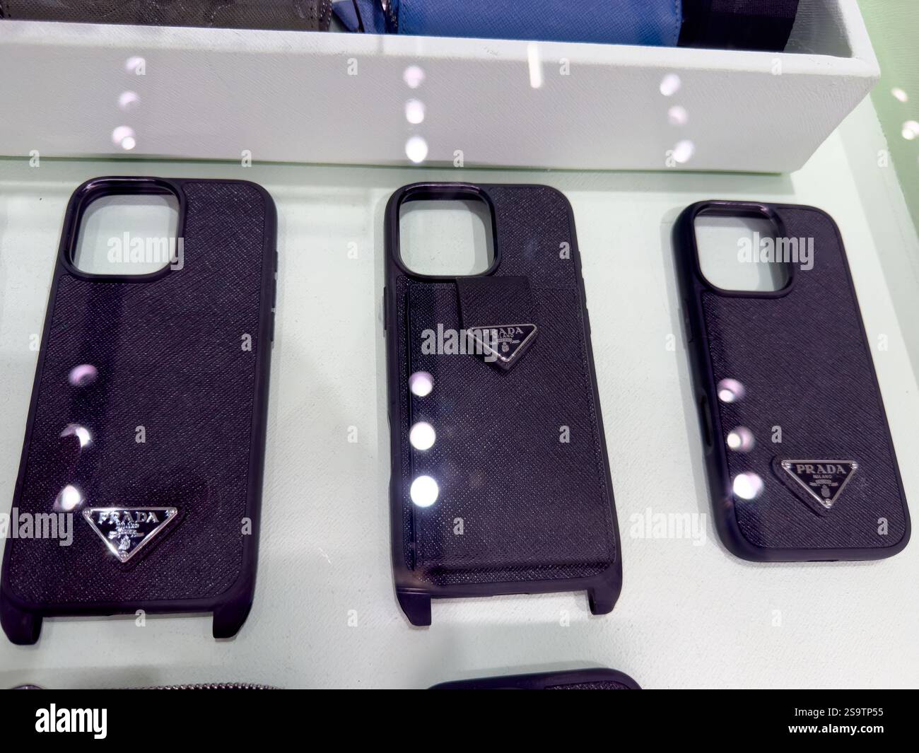 Elegant smartphone cases display featuring luxury design in a boutique ...