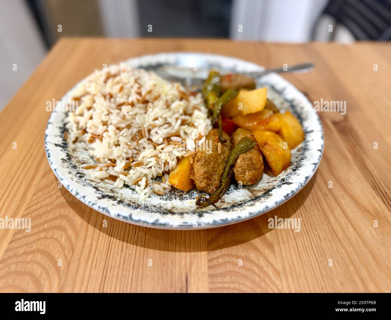 Homemade Turkish izmir kofte kofta and pilav pilaf on wooden table ...