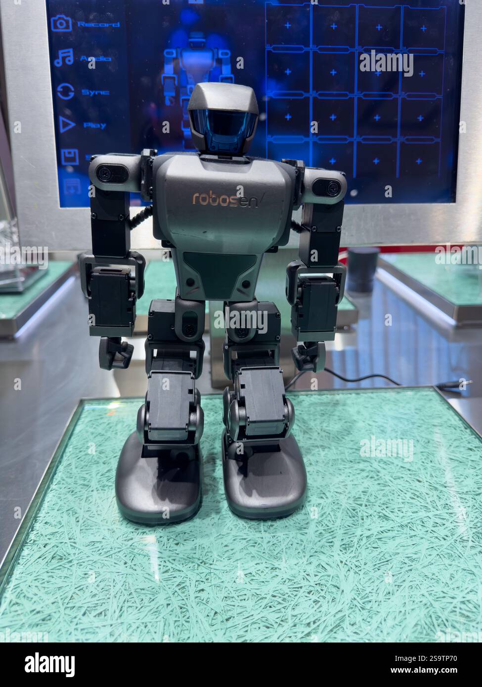 Compact robotic figure showcases technology at innovation exhibition ...