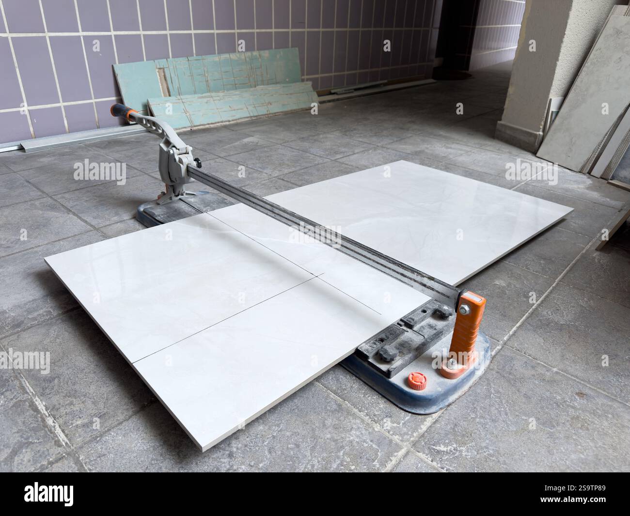 Setting up a tile cutter for precision work in a modern renovation ...