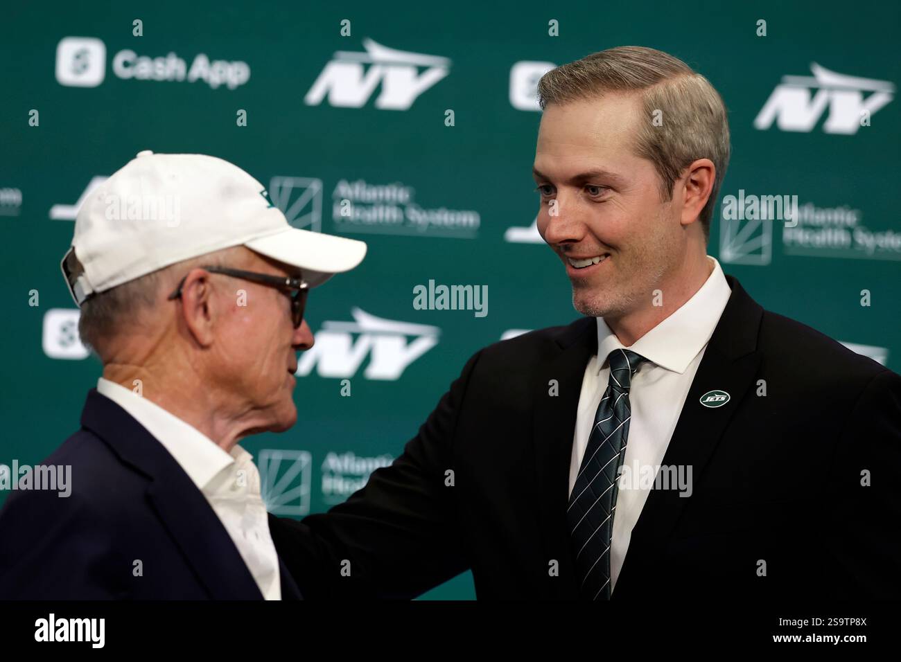 New York Jets new general manager Darren Mougey smiles with owner Woody ...