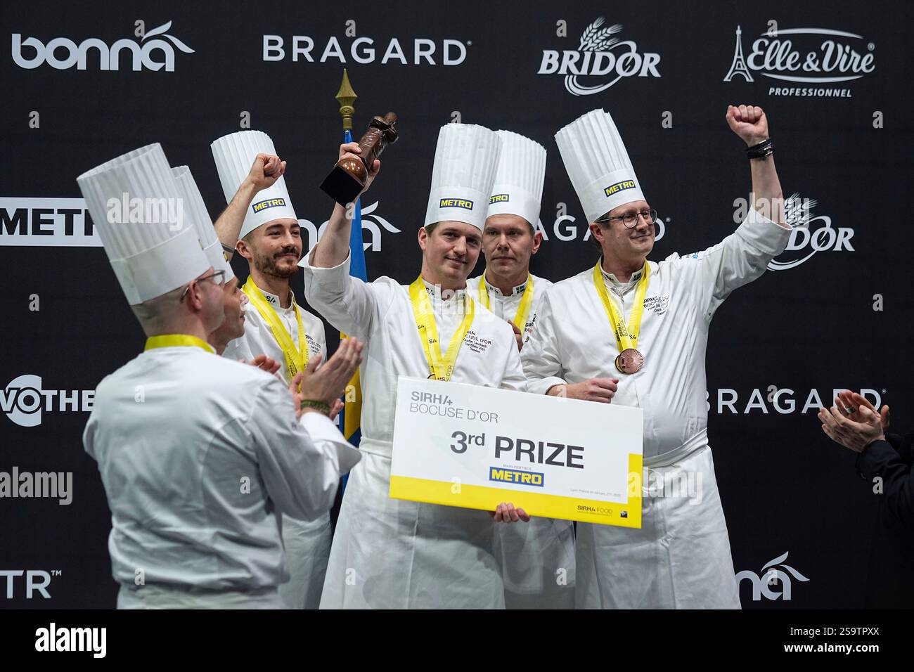 Sweden chef Gustav Leonhardt, center, celebrates on the podium with his ...