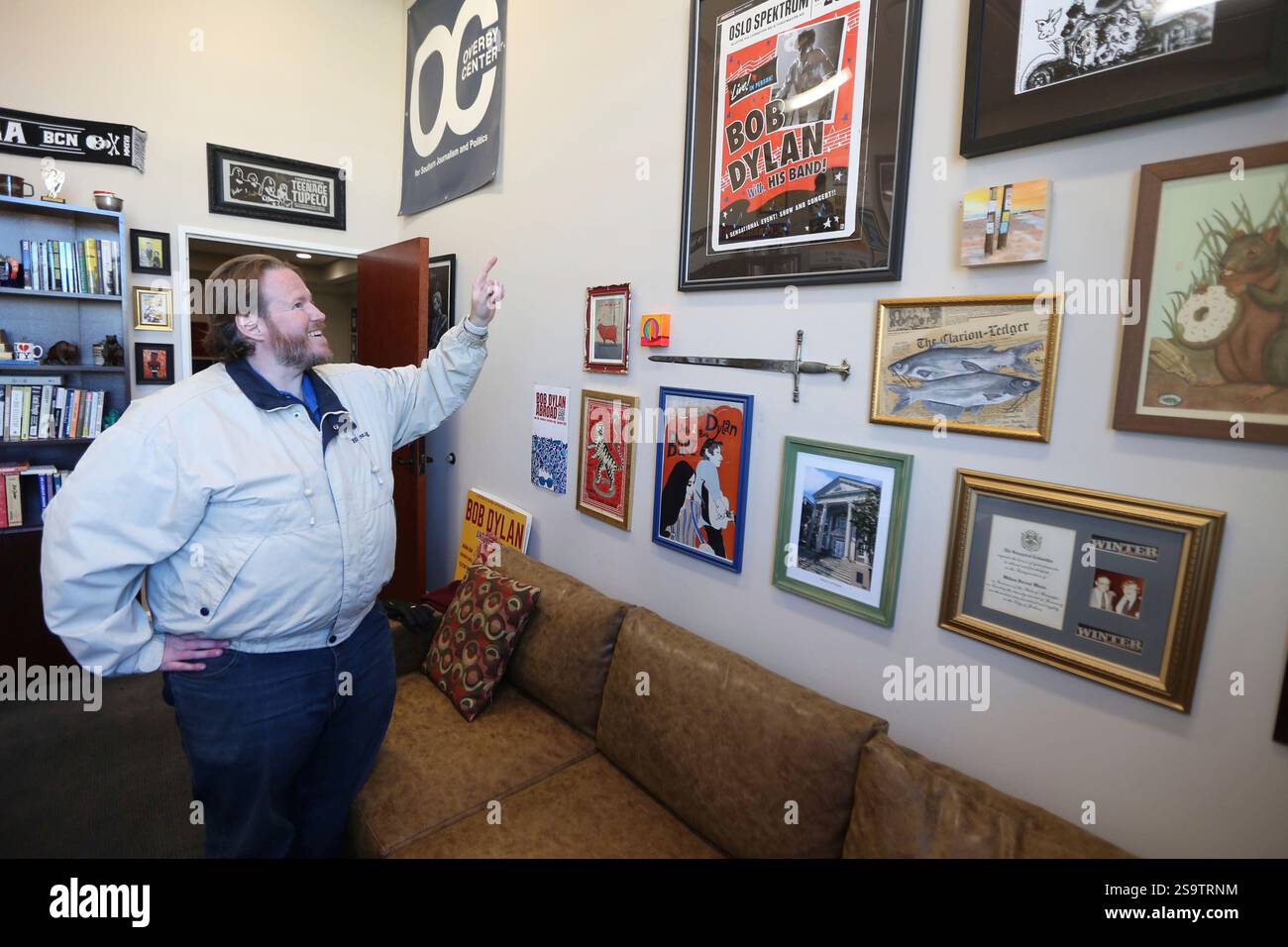 Dr. R.J. Morgan, a journalism professor at Ole Miss, looks over some of ...