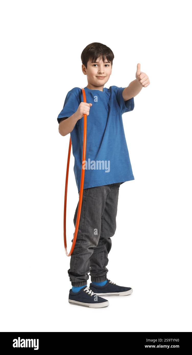Boy with hula hoop showing thumbs up on white background Stock Photo ...