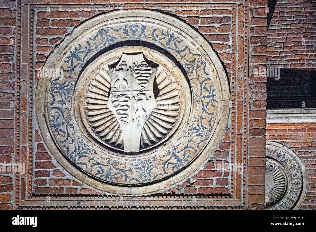 round beautiful italian bas-relief with symbols Stock Photo - Alamy