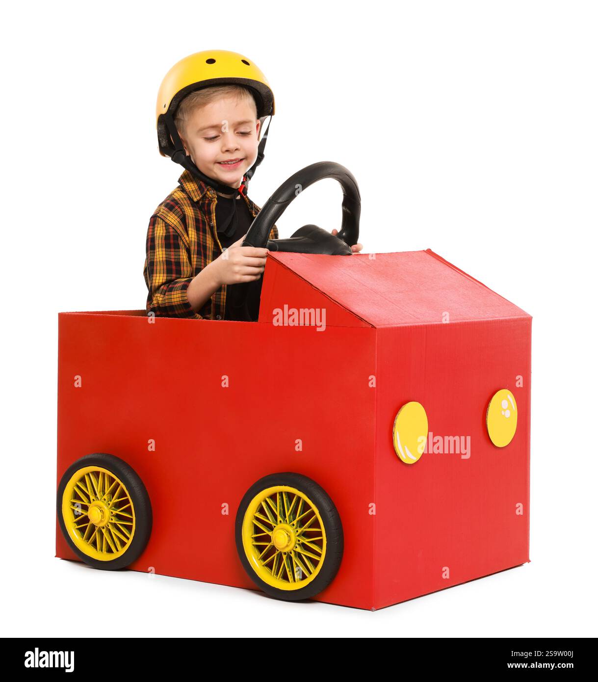 Little boy driving car made of cardboard on white background Stock ...
