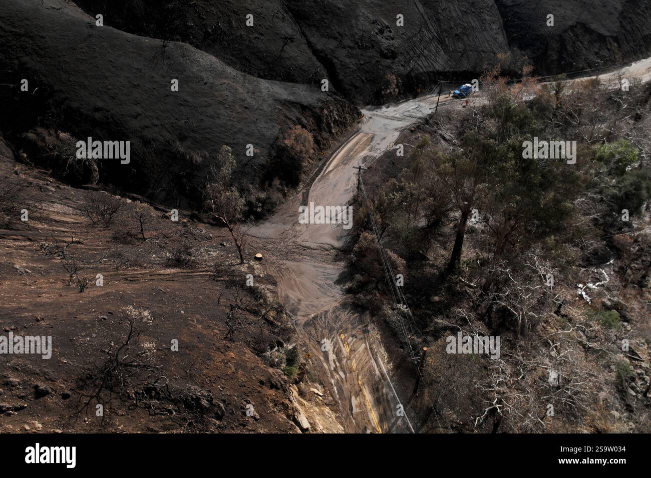 Mud covers Topanga Canyon Rd. on the Palisades Fire burn area after a ...
