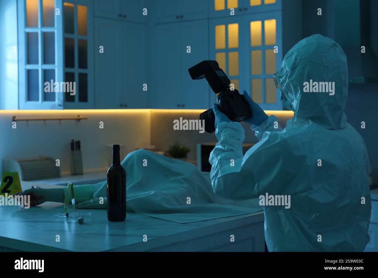 Forensic expert with camera working at crime scene and dead woman's ...