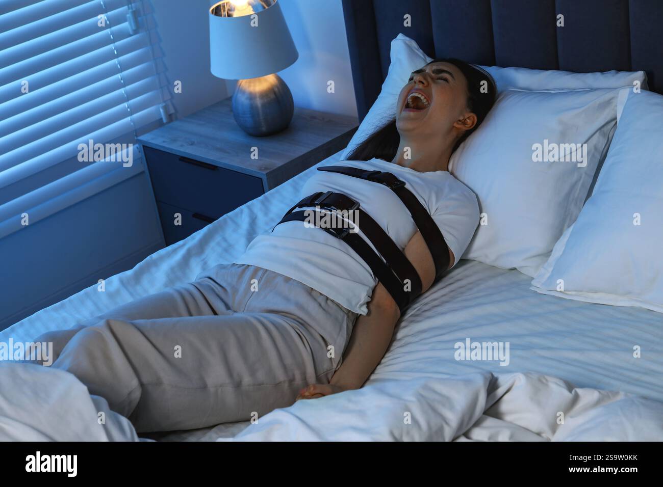 Woman in sleepwalking condition screaming on bed Stock Photo - Alamy
