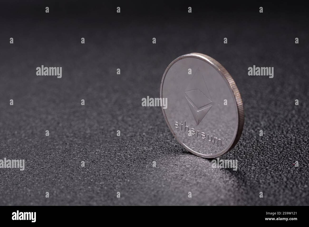 Ethereum cryptocurrency dummy in the form of a round iron coin ...