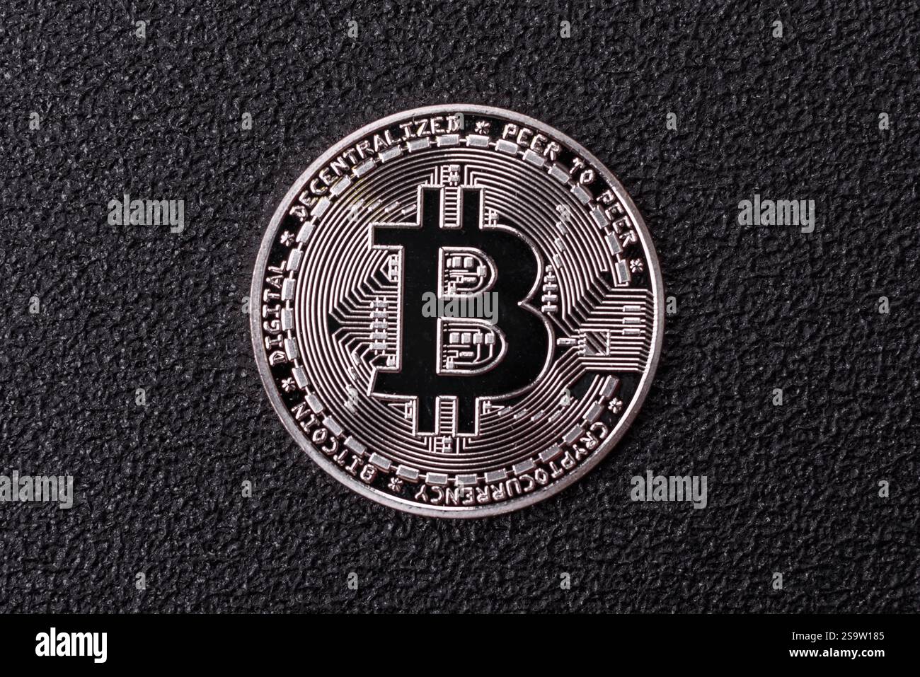 Bitcoin cryptocurrency dummy in the form of a round iron coin ...