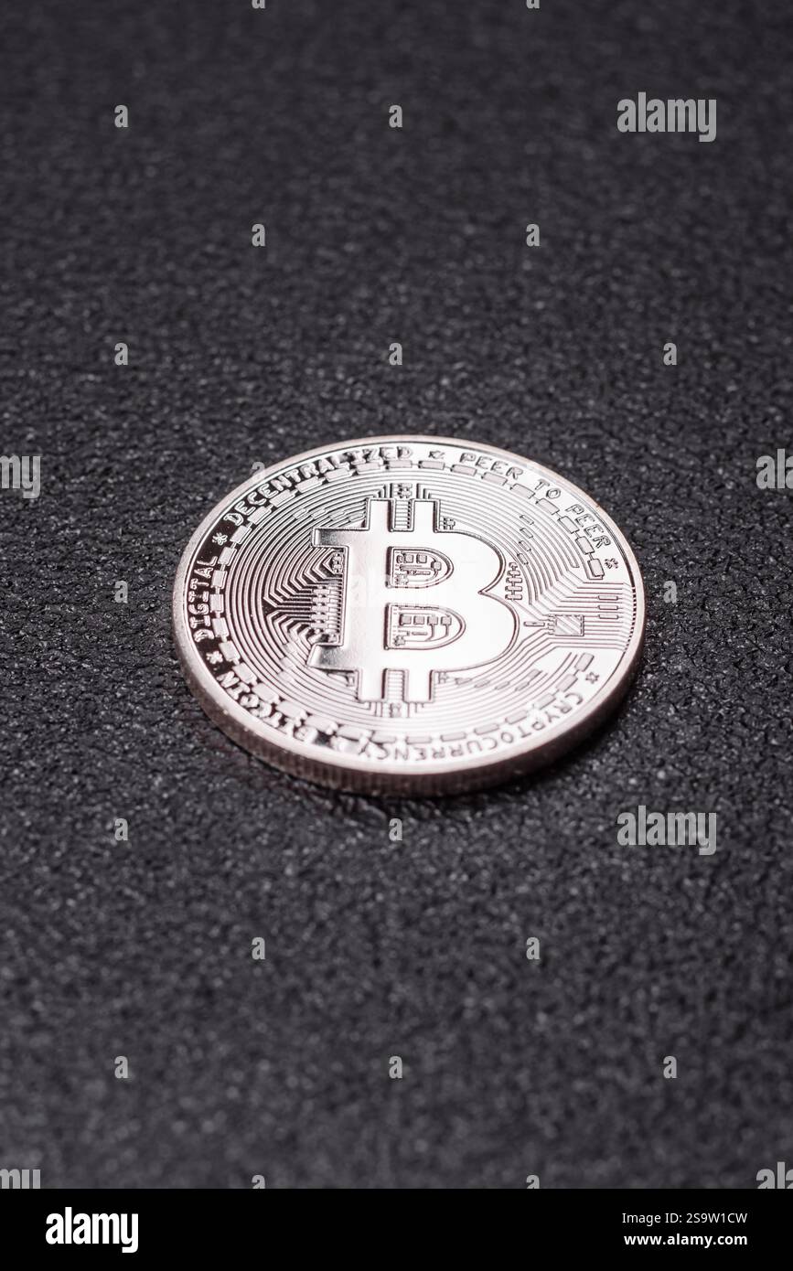 Bitcoin cryptocurrency dummy in the form of a round iron coin ...