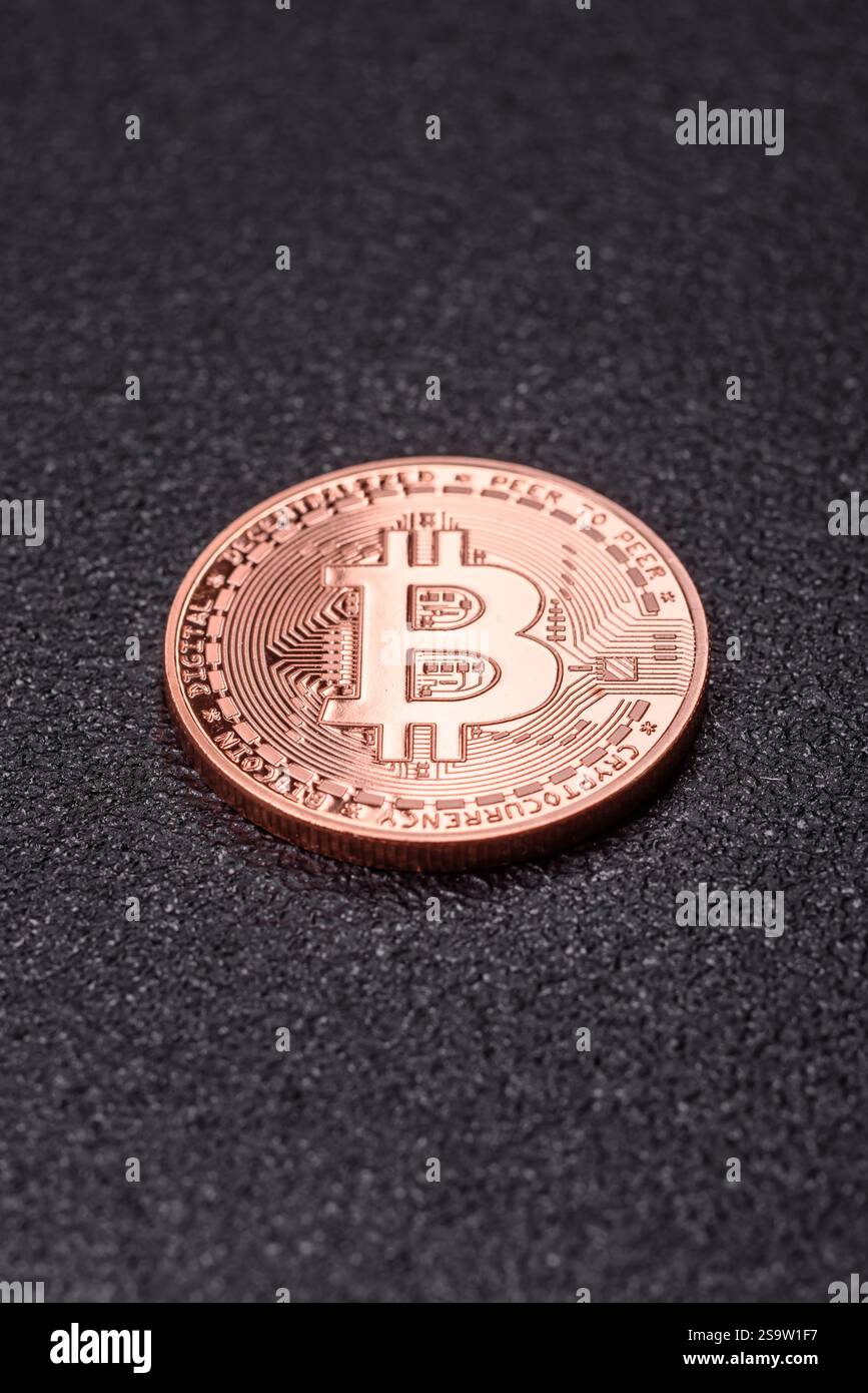 Bitcoin cryptocurrency dummy in the form of a round iron coin ...