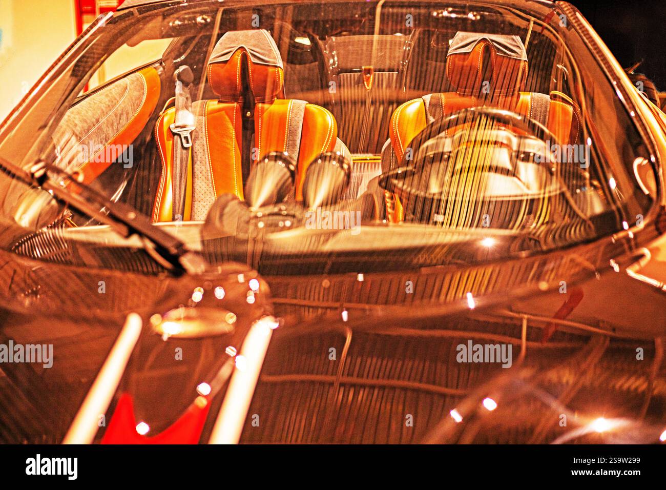 showroom in a racing car with orange seats. Car design Stock Photo - Alamy