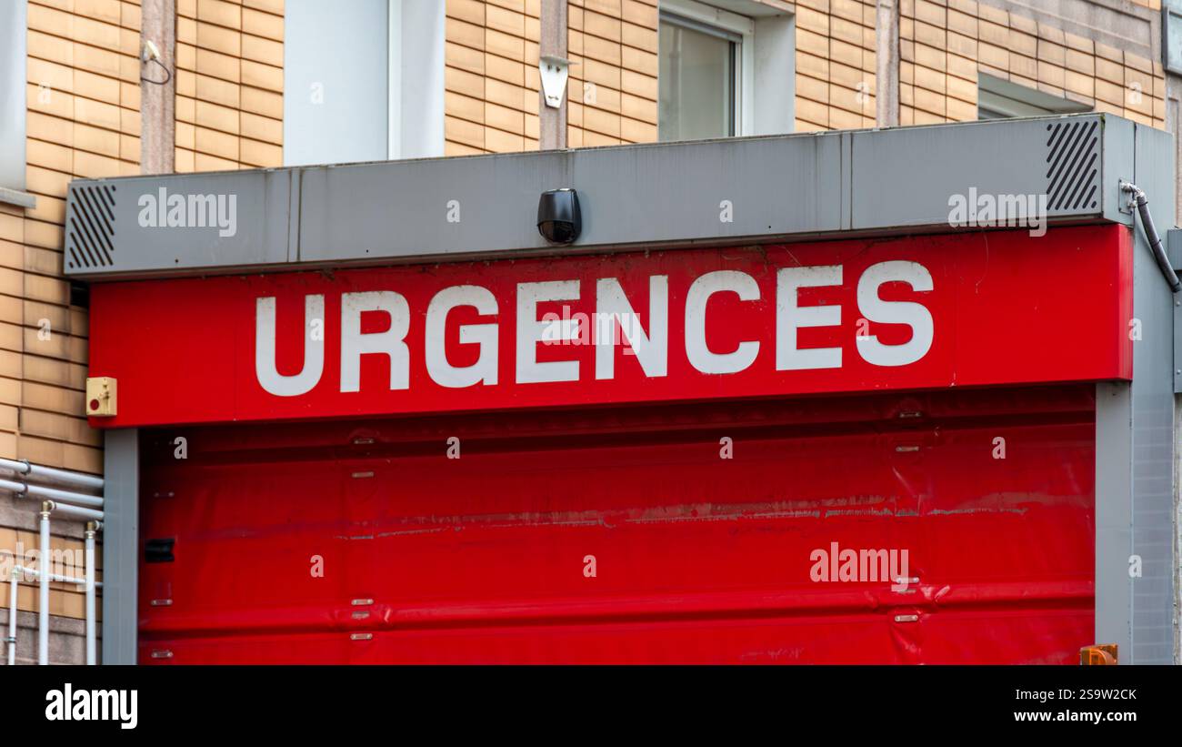 'EMERGENCIES' sign written in French indicating the ambulance-only ...