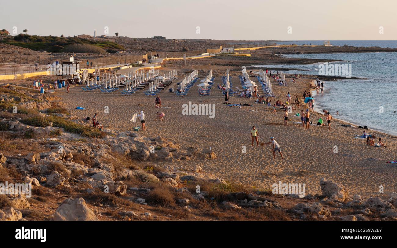 Early Evening sunshine lights the Venus beach in Paphos, cyprus. This ...