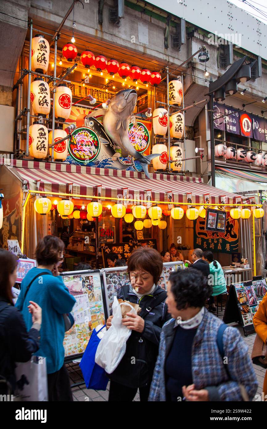 Shops and restaurants in the famous shopping district Ueno Ameyoko ...