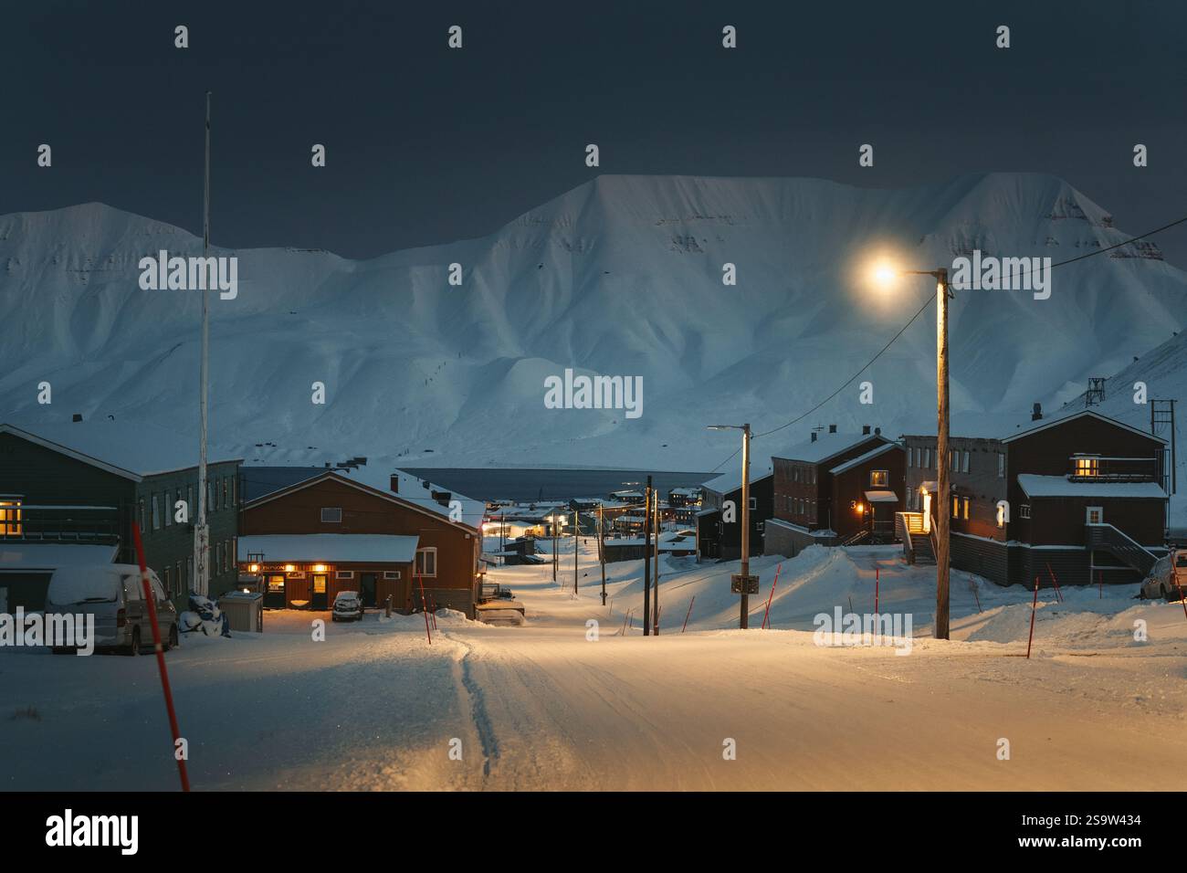 Town of Longyearbyen, Svalbard in front of snowy arctic fjord in the ...