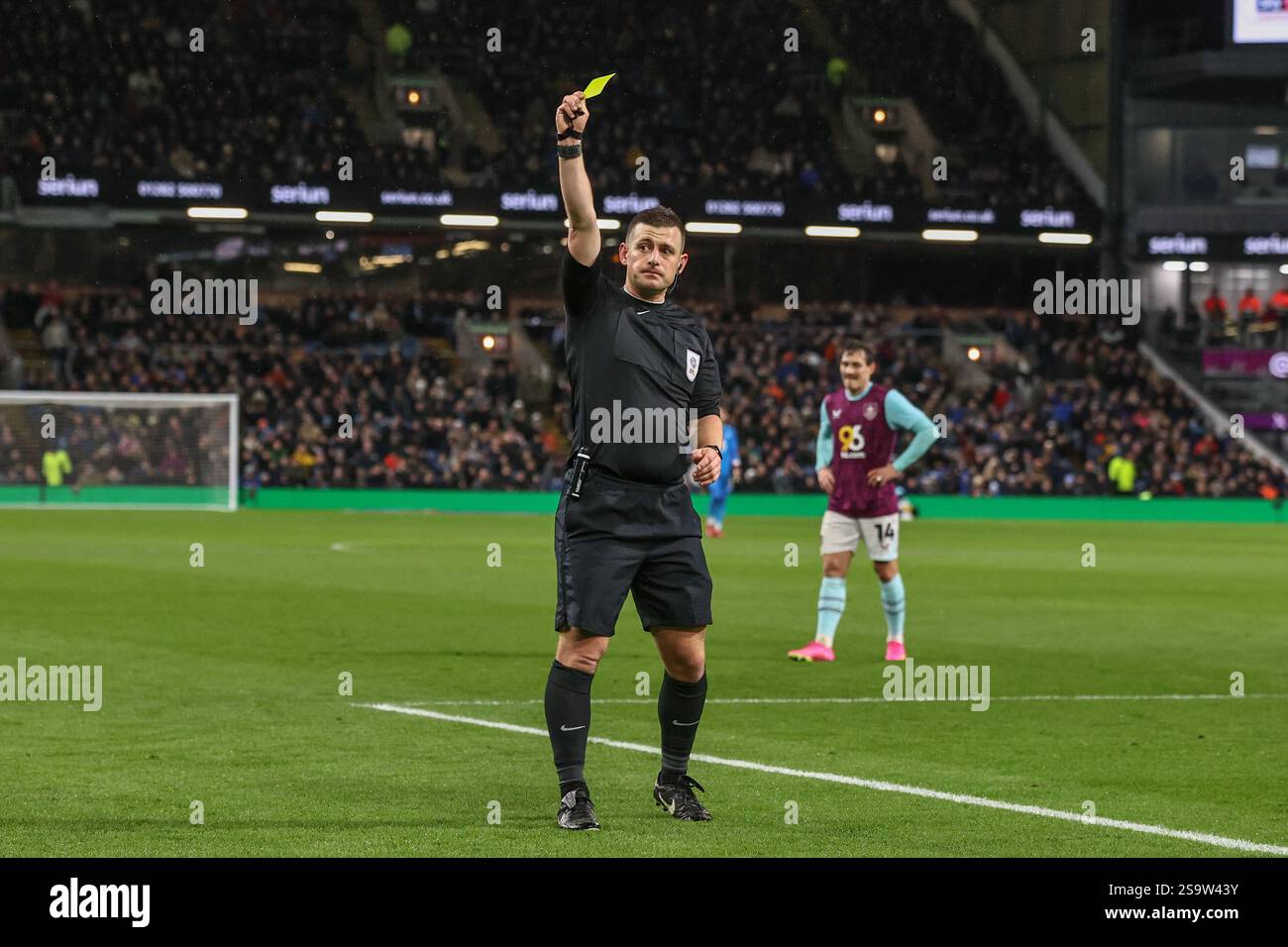 Referee Josh Smith gives a yellow card to Manor Solomon of Leeds United ...