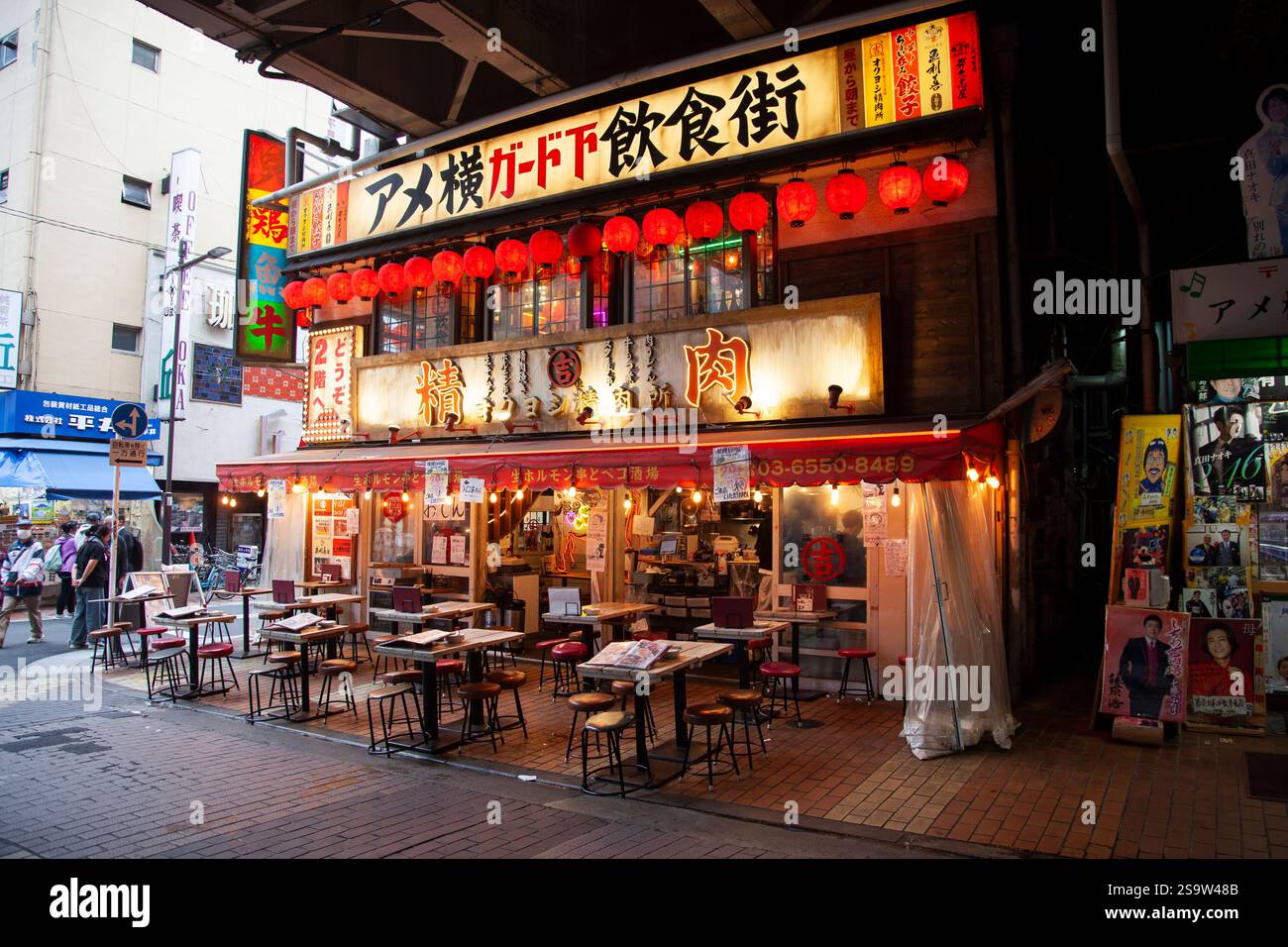 Shops and restaurants in the famous shopping district Ueno Ameyoko ...