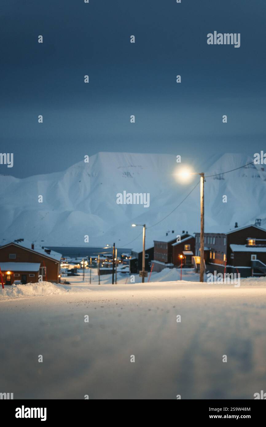 Longyearbyen Svalbard town in front of snowy fjord and arctic mountain ...