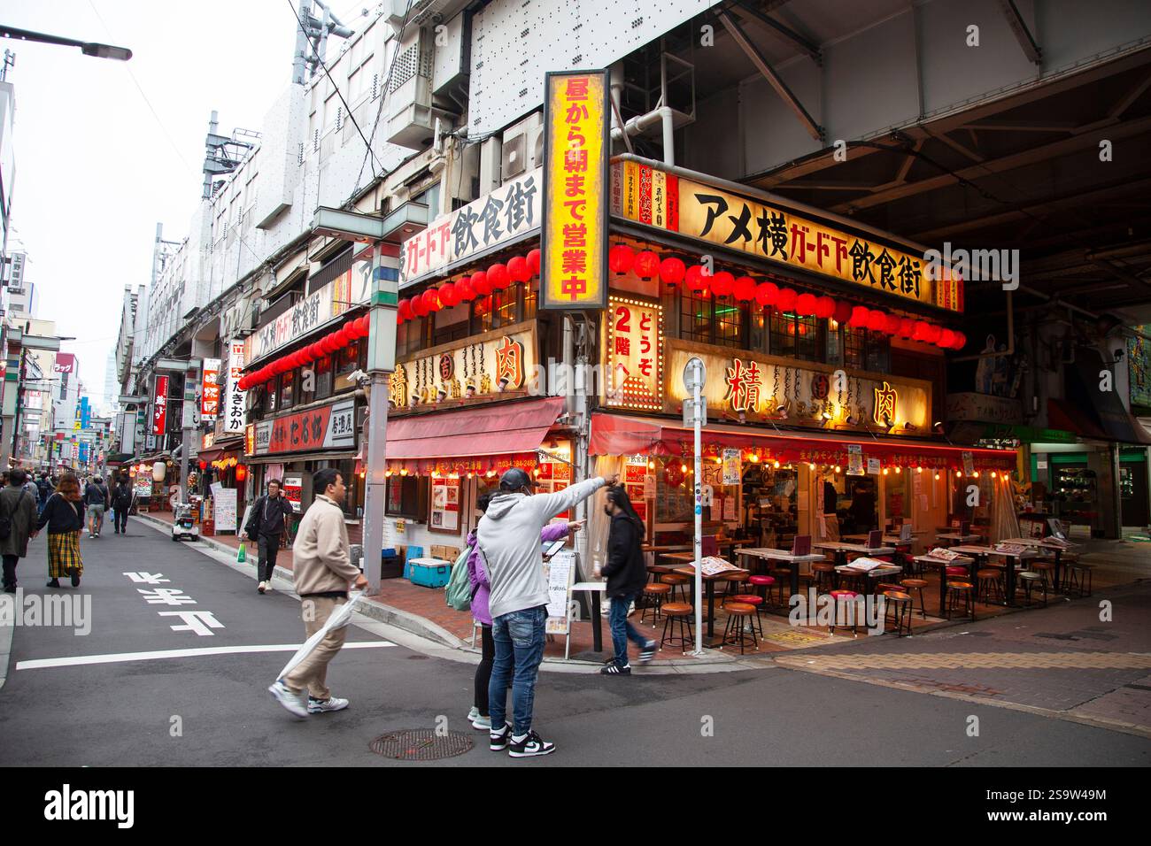 Shops and restaurants in the famous shopping district Ueno Ameyoko ...