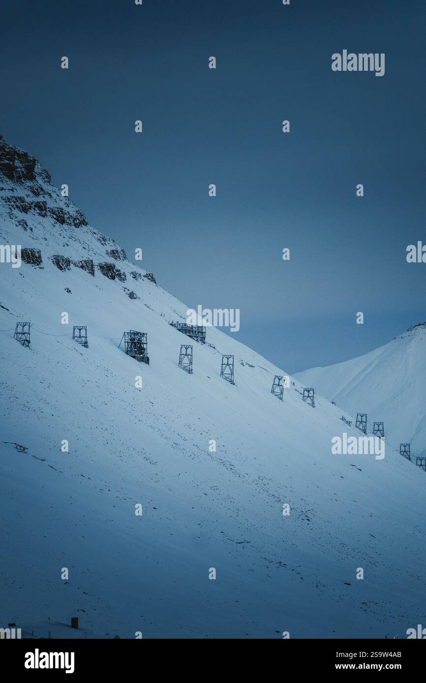 Snowy mountain with mining cable tramway in Longyearbyen Svalbard in ...