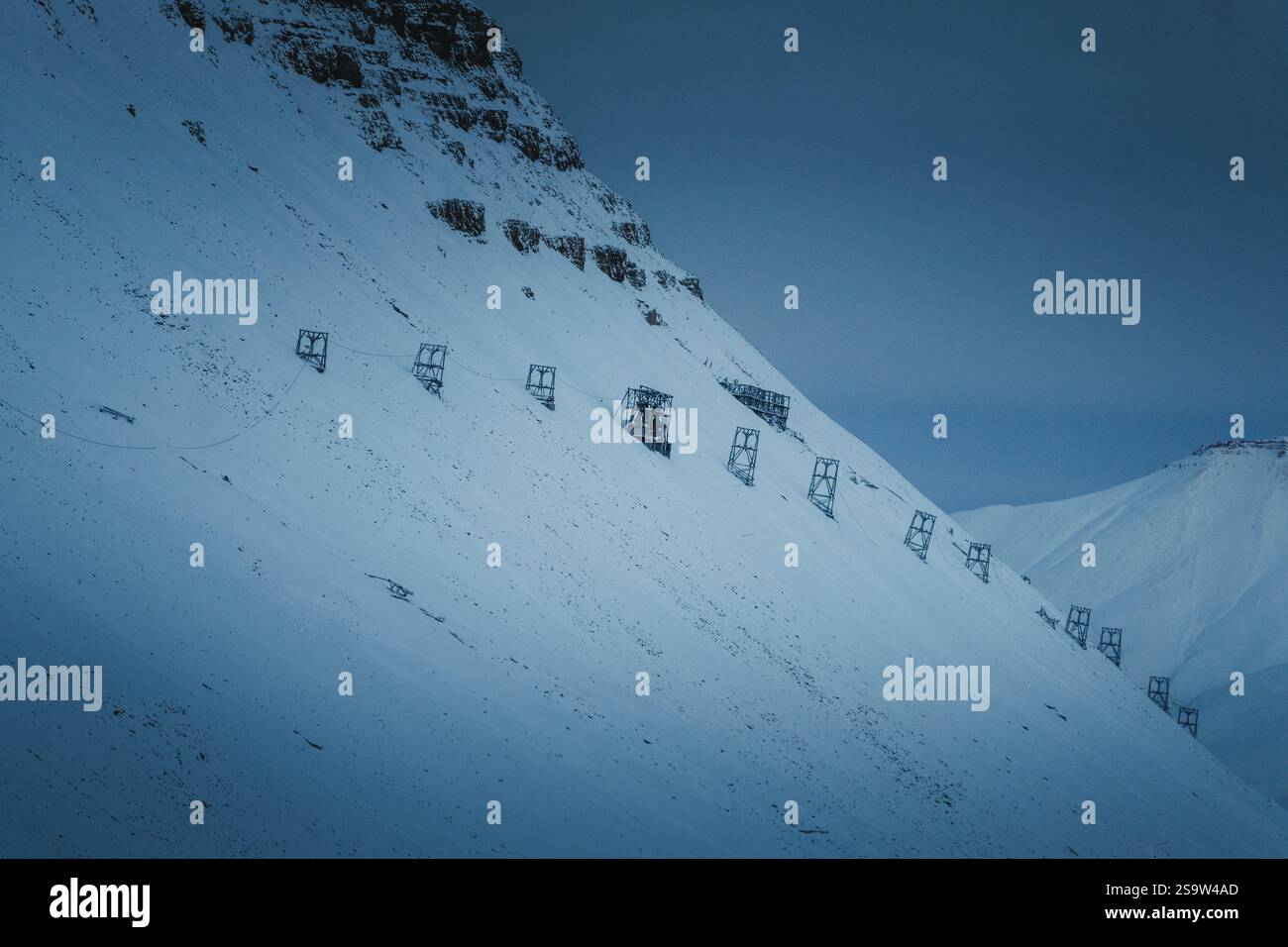 Mining cable tramway on snowy mountain in Longyearbyen, Svalbard in ...