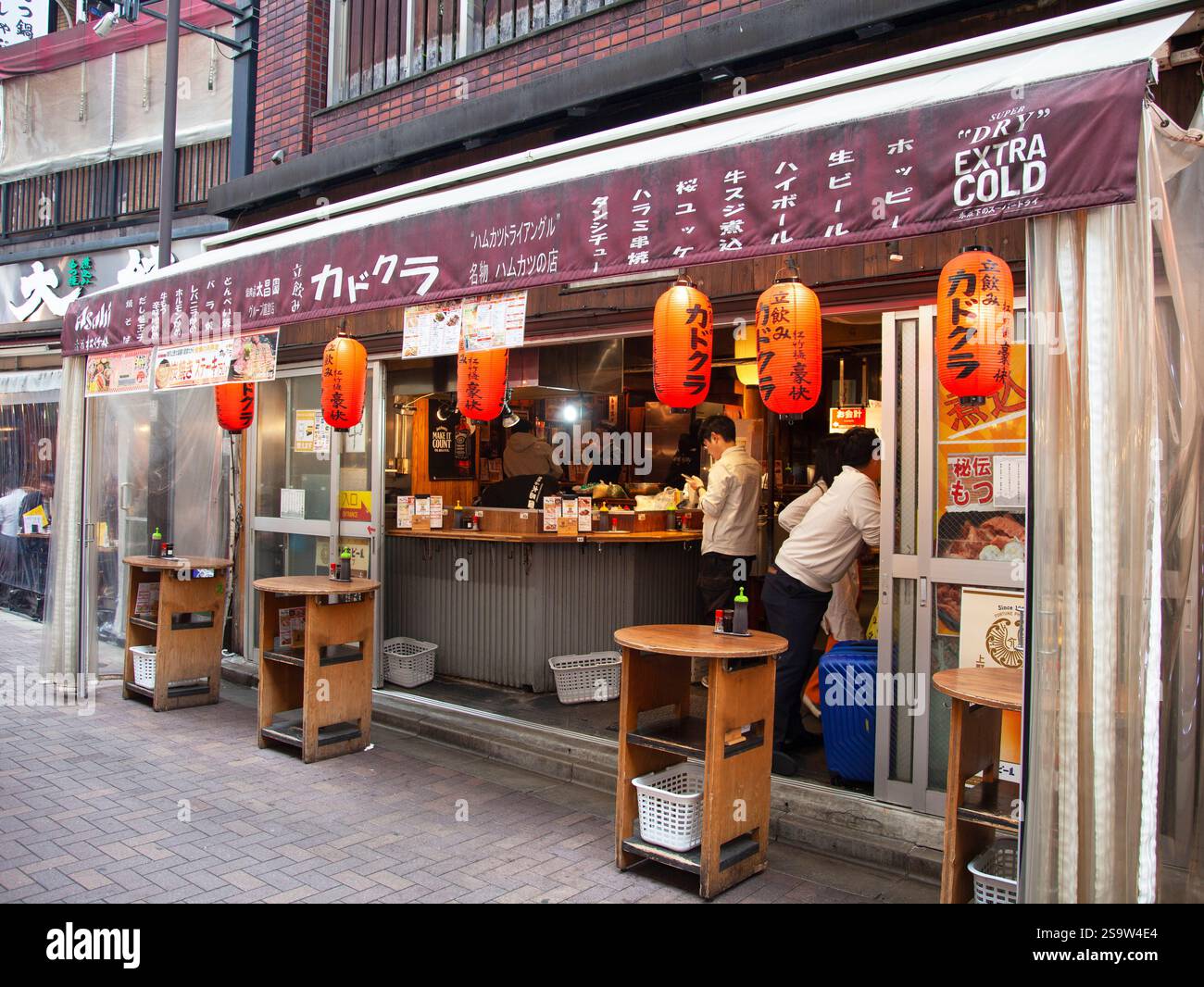 Shops and restaurants in the famous shopping district Ueno Ameyoko ...