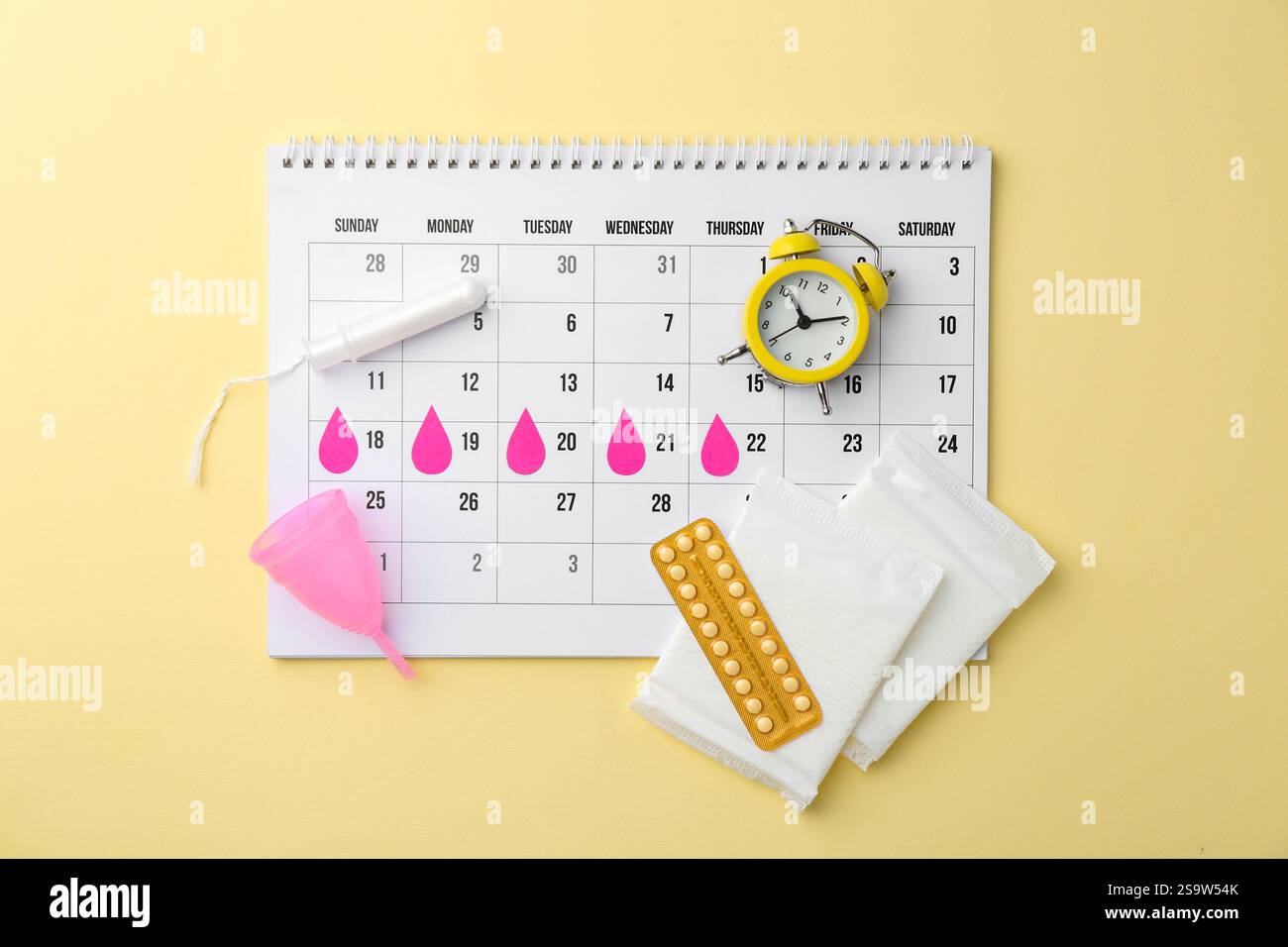 Flat lay composition with calendar and menstrual products on beige ...