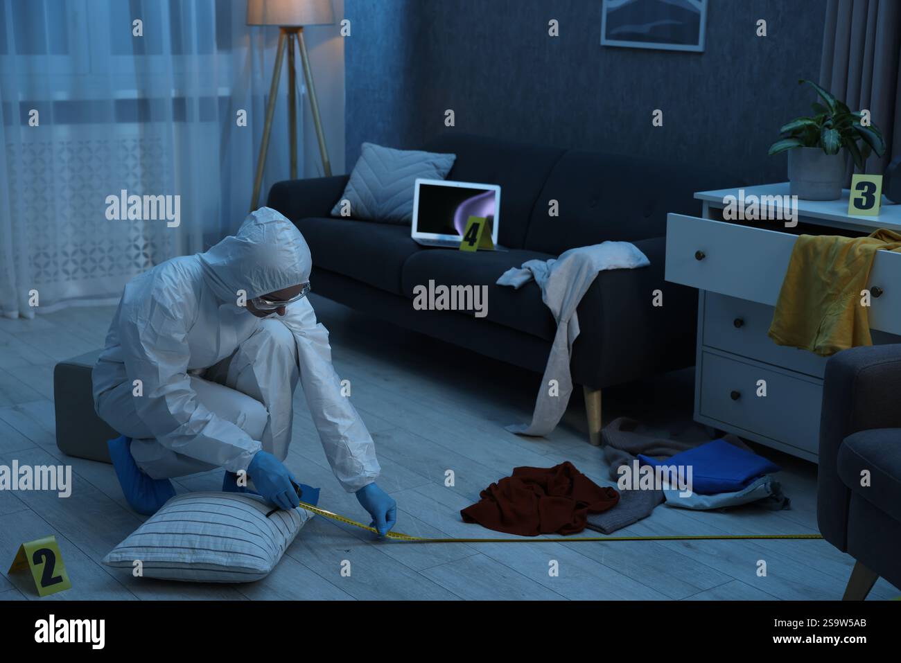 Forensic expert with measuring tape working at crime scene in messy ...