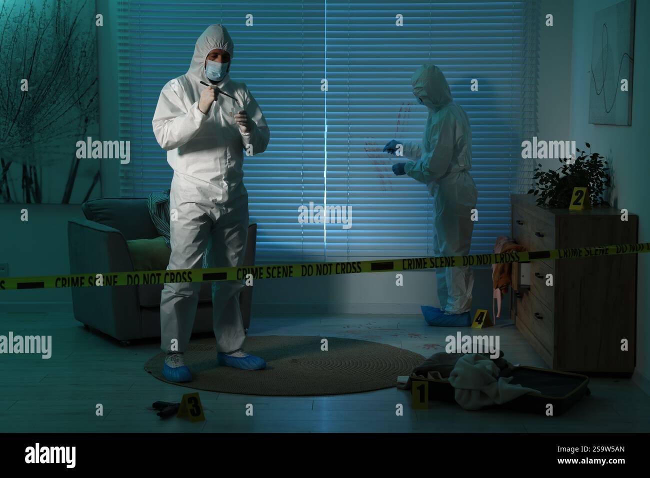 Forensic experts working at crime scene indoors Stock Photo - Alamy