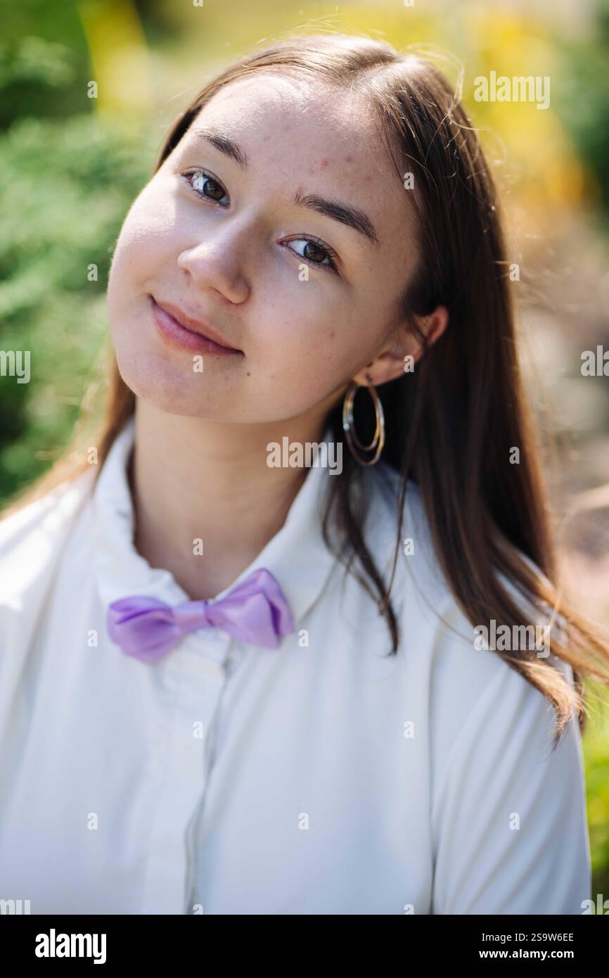 Photo of a happy student in a bow tie, savoring her first day of school ...