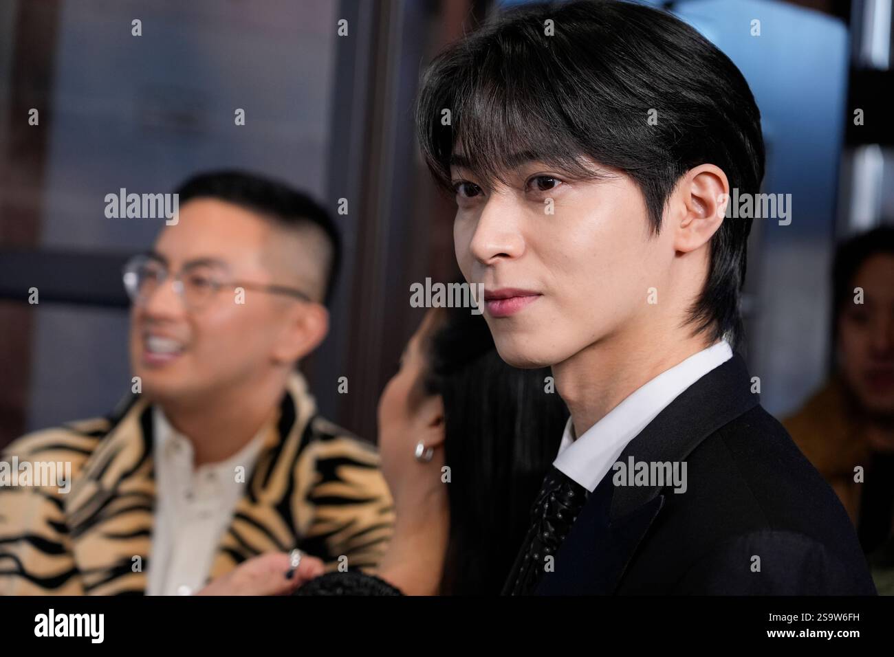 Bowen Yang, from left, Kelly Marie Tran, and Han Gi-chan attend the premiere of "The Wedding ...