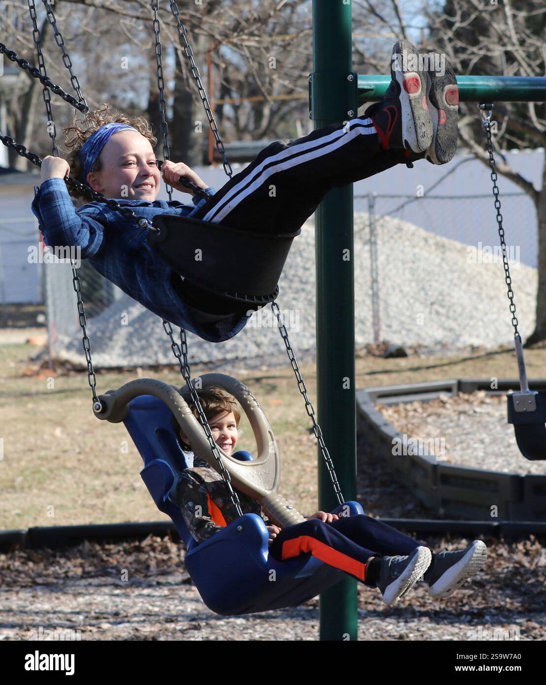 Kade Pearl, 9, gets some height in his swing as he plays with his ...