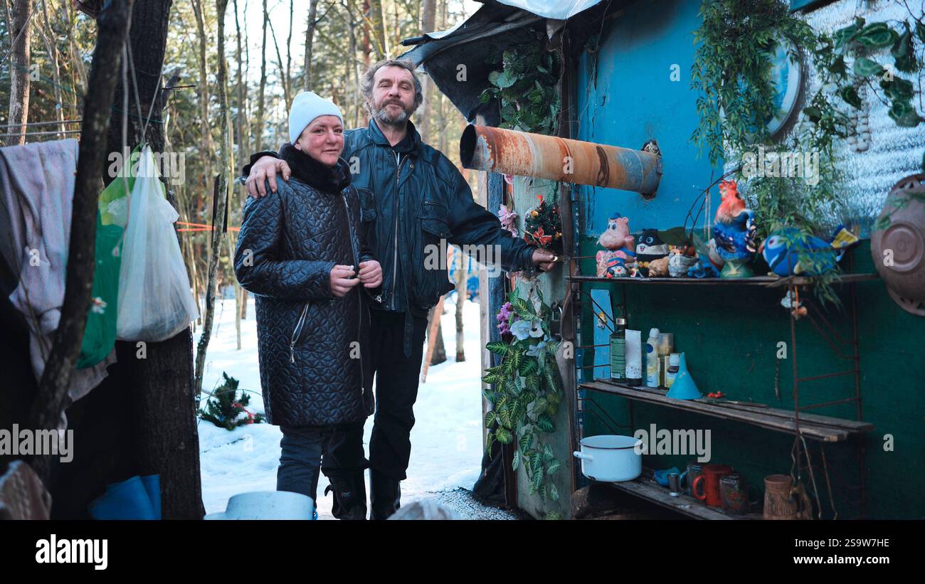 Homeless Couple Surviving Winter Near Makeshift Shelter Depicting