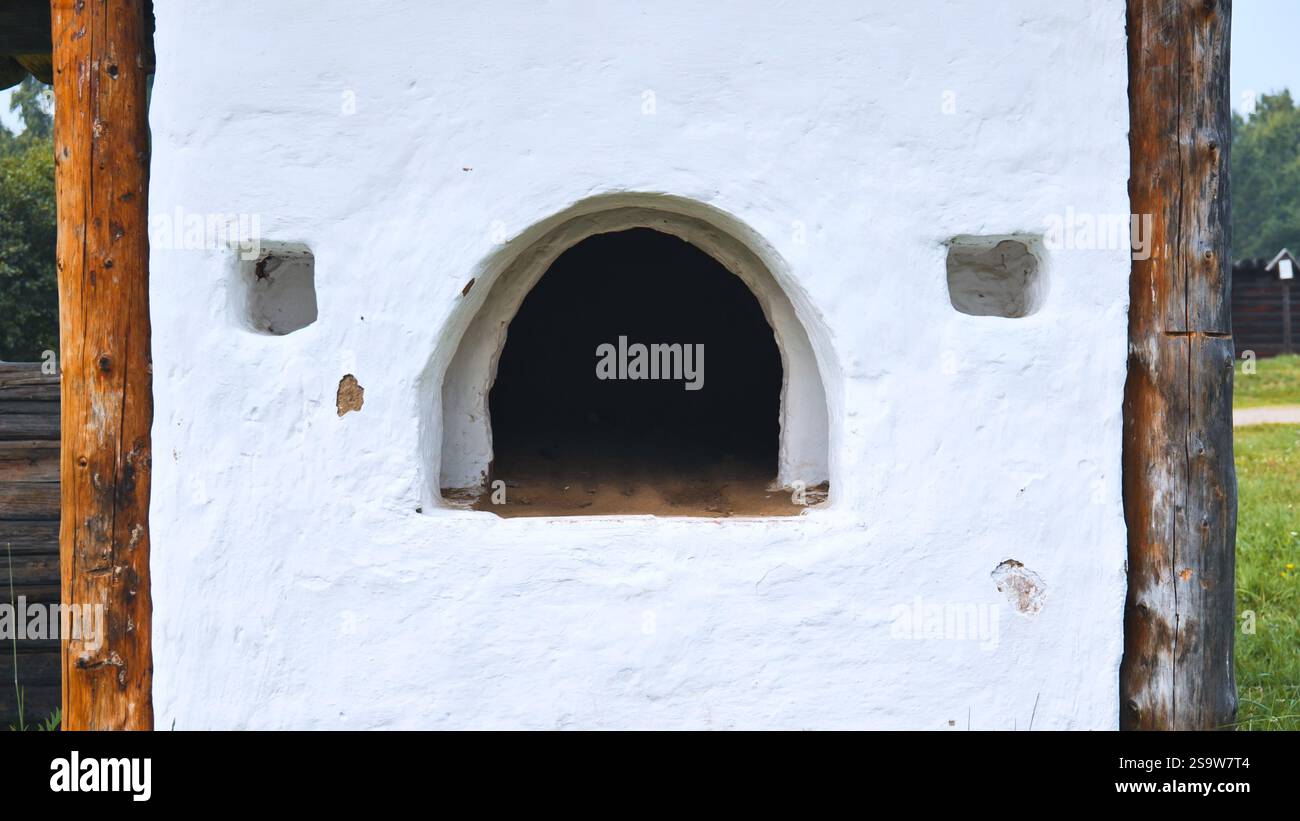 Traditional Russian oven, outdoors under a canopy. The picture was ...